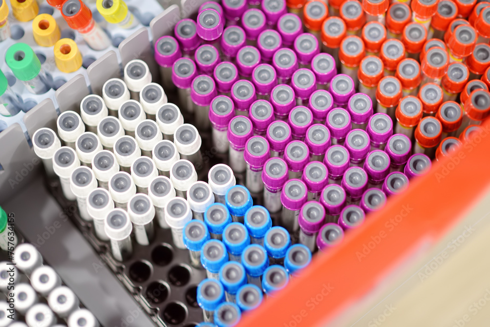 Top view of a lot of test blood tubes in laboratory of clinic or ...