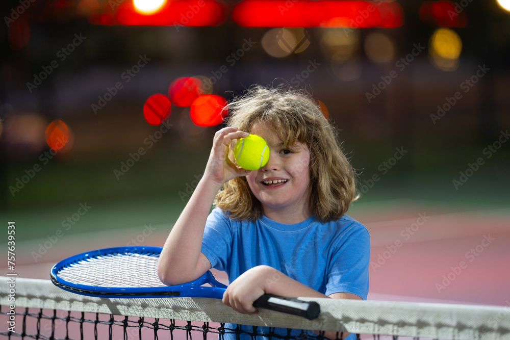 Child playing tennis on court. Child playing tennis in sport club ...