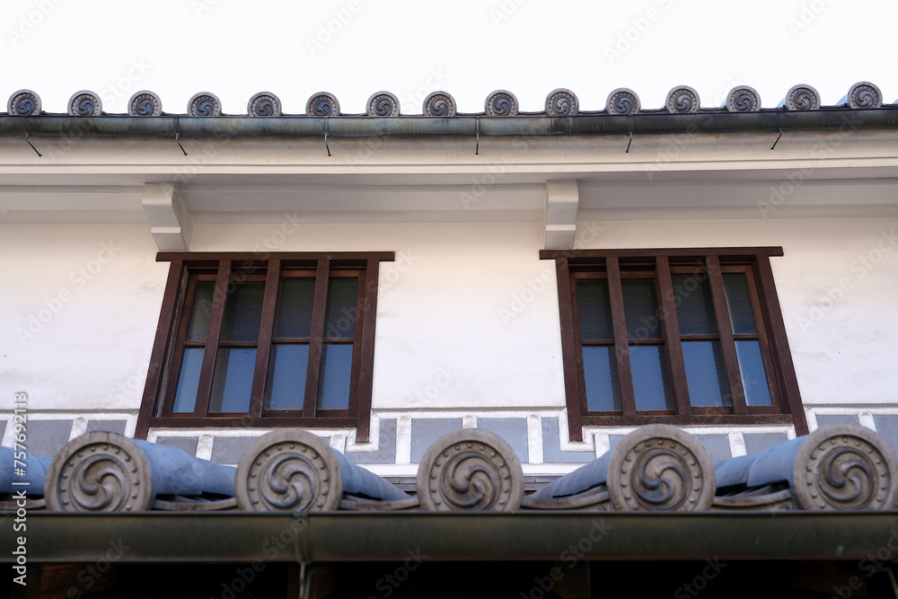 2nd floor window frames and traditional roof styles in an old Japanese ...