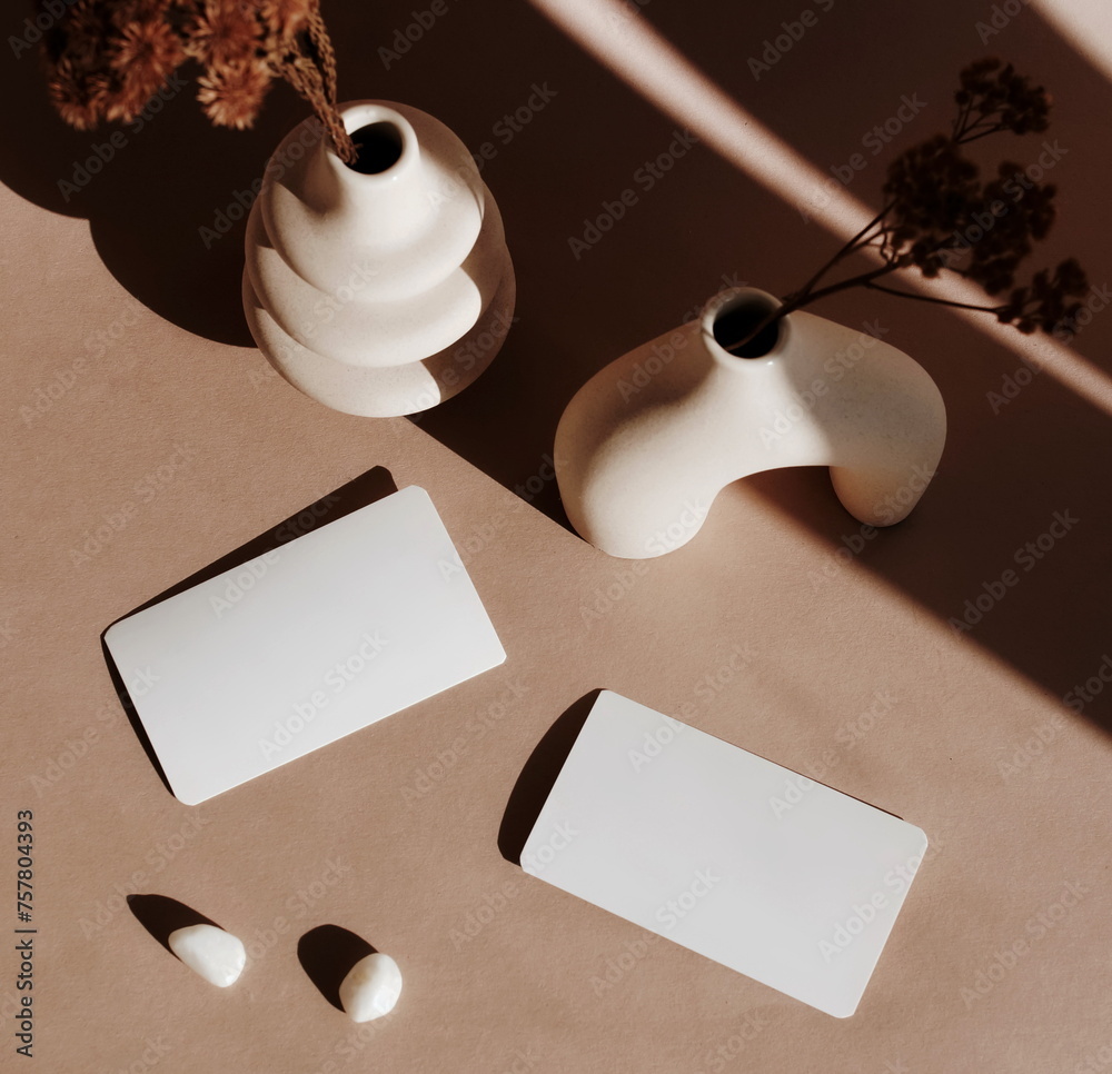 Blanks paper mockup ,modern beige vasen with dry grass , sunlight ...