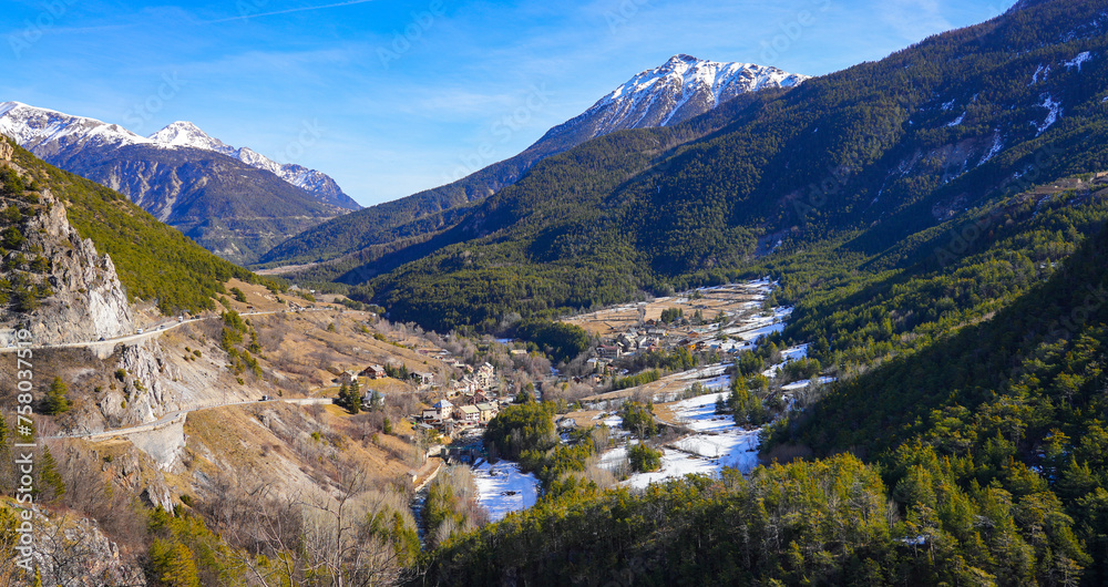 Alpine village of Le Fontenil overlooked by the snow capped Crête de ...