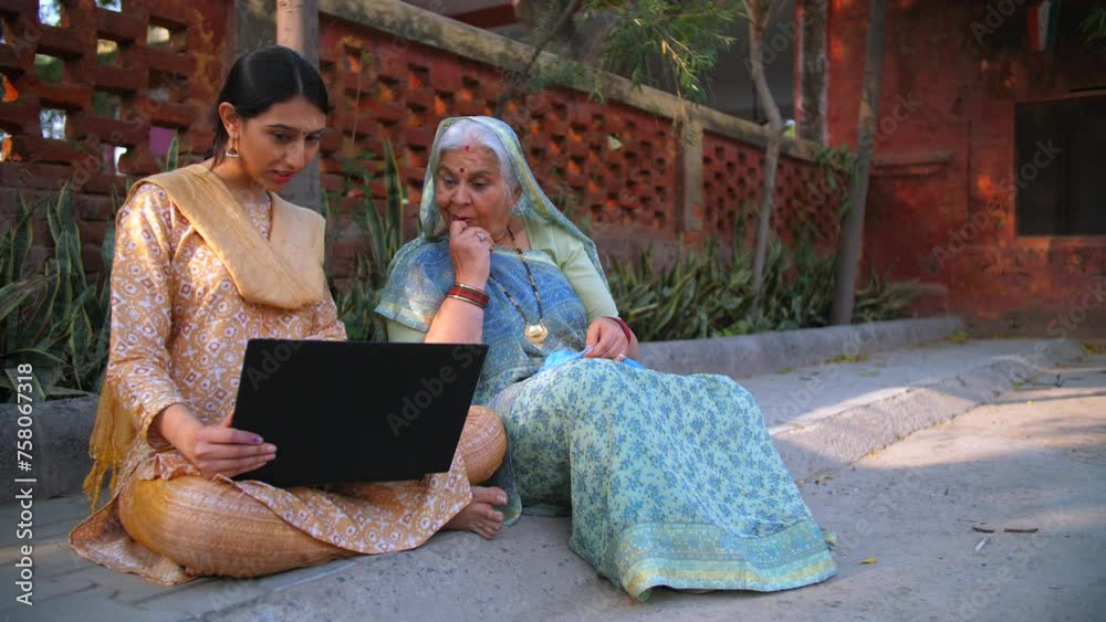 A beautiful young Indian using laptop with her grandma - dadi: success ...
