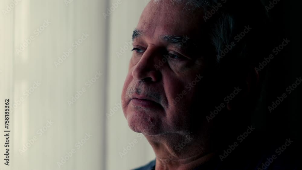 Vidéo Stock Desolate senior man standing at window peering outside ...