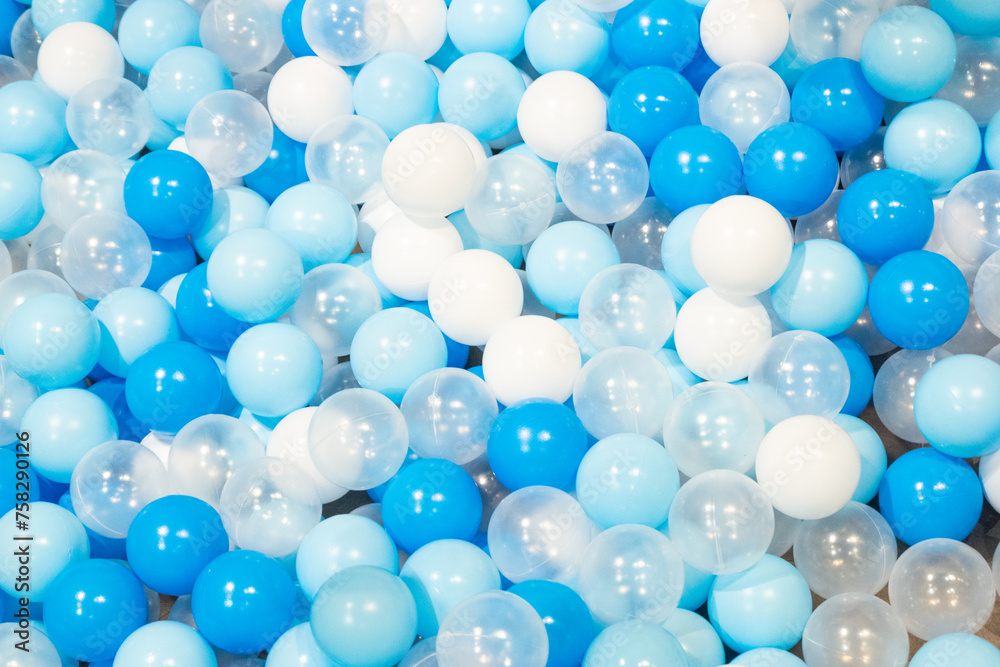 Colored plastic balls in pool of kindergarten school,White and blue ...