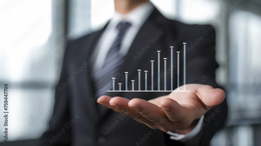 Professional executive displaying a holographic growth chart ...