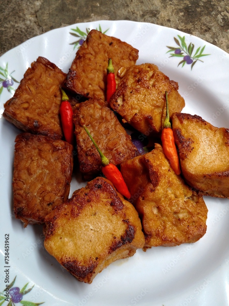 Tempeh tahu bacem. Tempeh and tofu are boiled with spices and brown ...