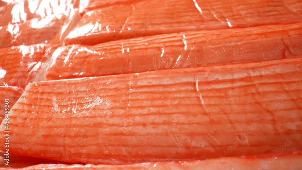 Close-up of crab sticks reveals their pinkish hue, resembling real crab ...