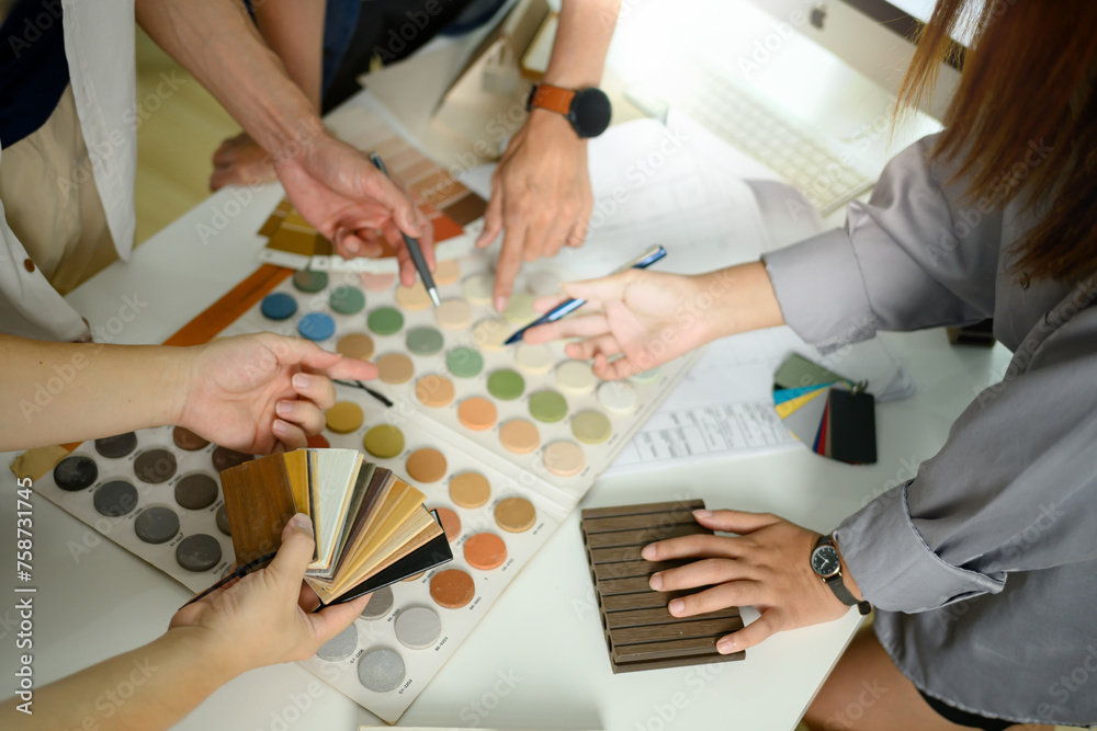 Professional interior designers planning for house project working with material sample on ...