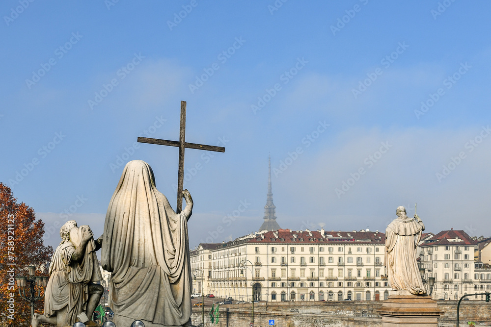 Back view of the statue "Religion", the top of the Mole Antonelliana ...