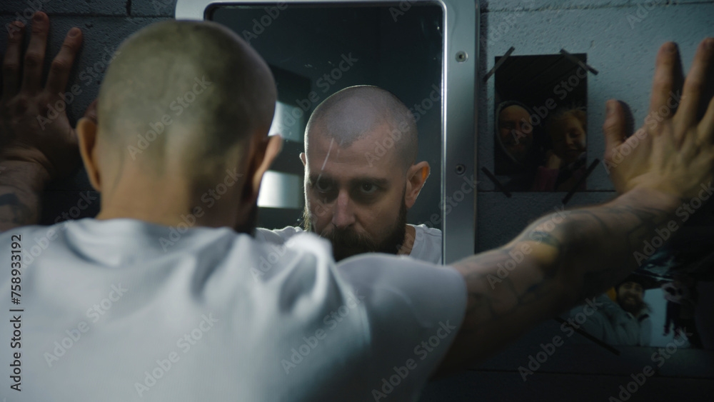 Illegally convicted man looks at himself in the mirror, puts hand on ...