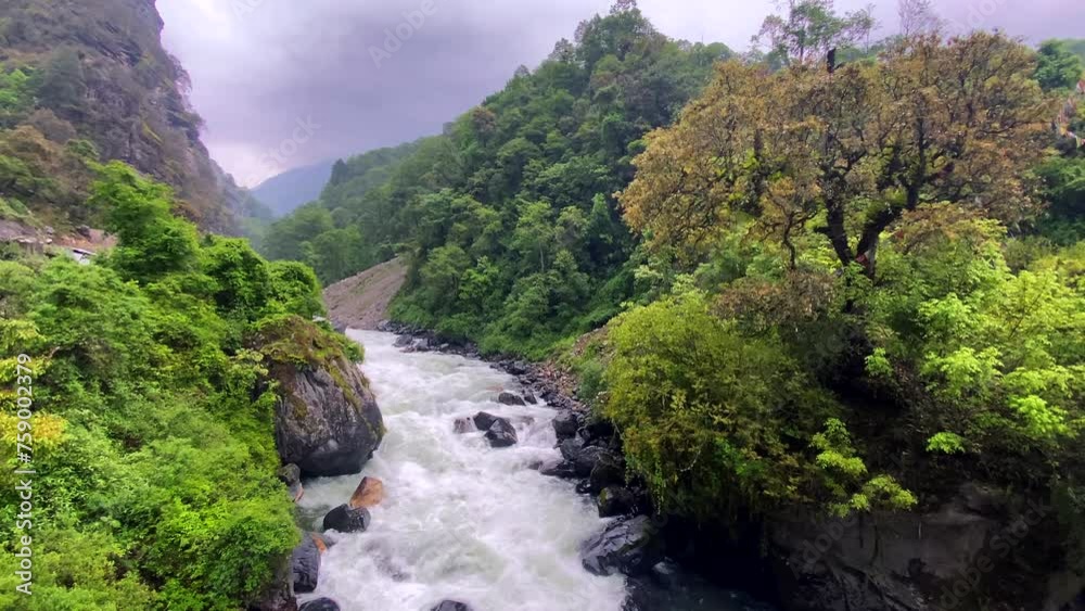 Storm clouds over mountains of Jang town deep in the nurangang river ...