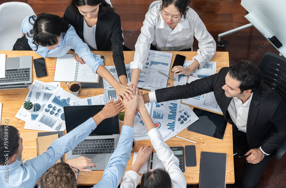 Multiracial business people make synergy hand stack together in meeting ...