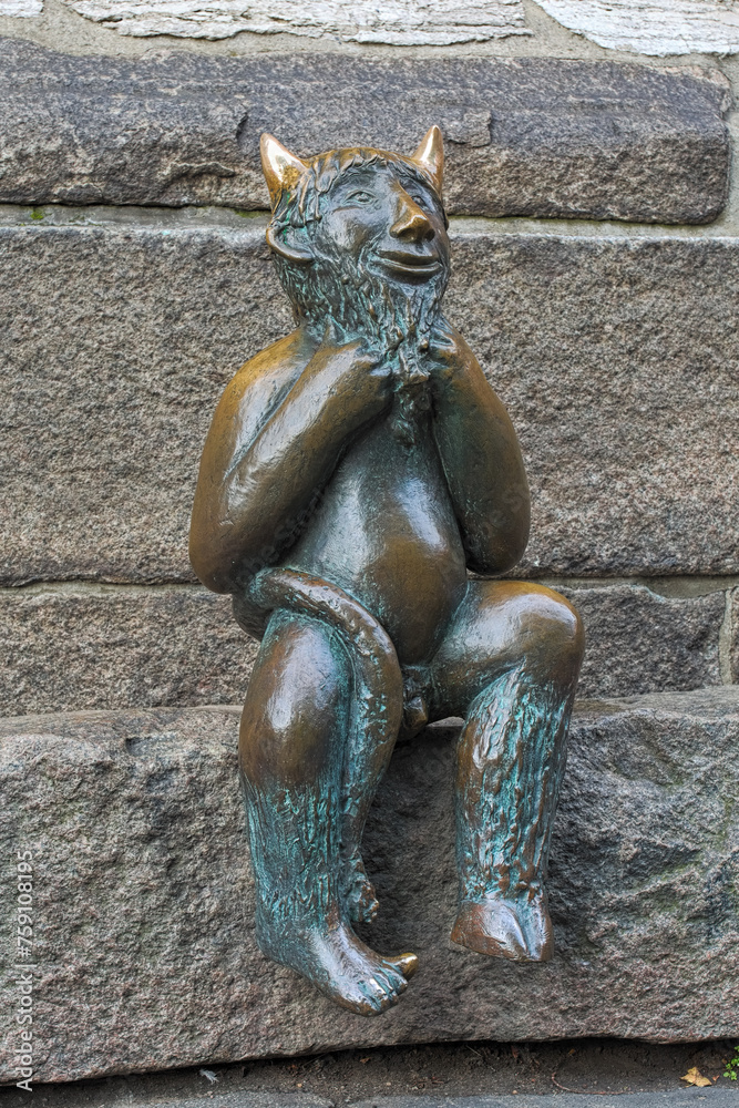 Lubeck, Germany. Devil's figure on the Devil's stone outside the St ...