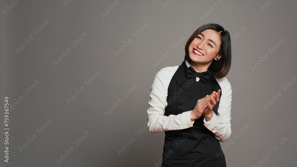 Restaurant hostess clapping hands and celebrating for someone, cheering ...