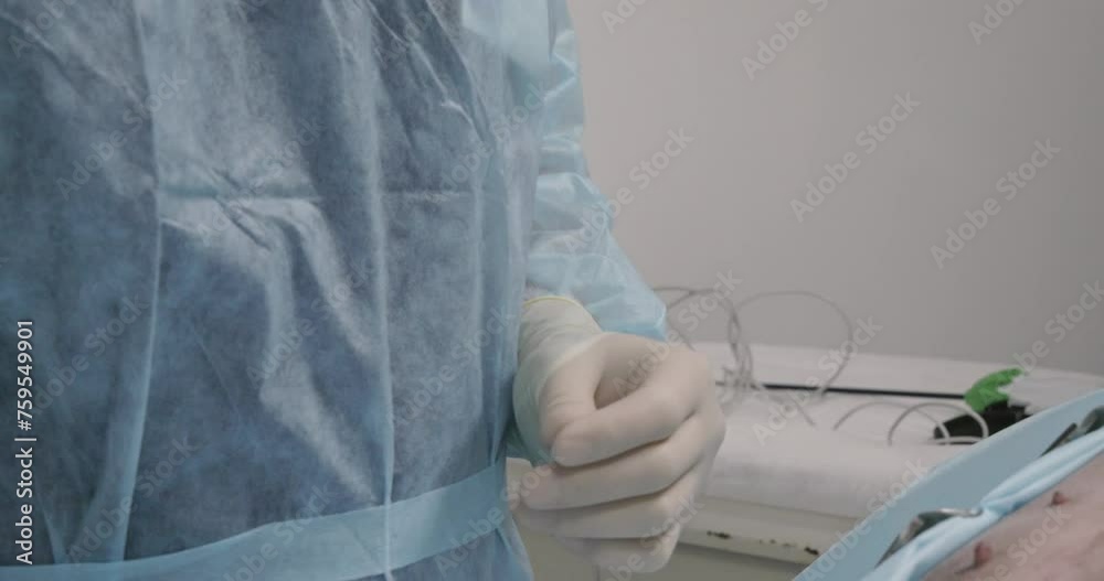 In the operating room, the surgeon places the attachment on the scalpel ...