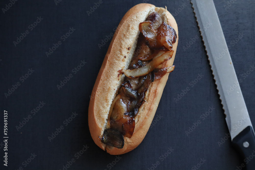 Boerewors roll with braised onions. South African sausage on a roll ...