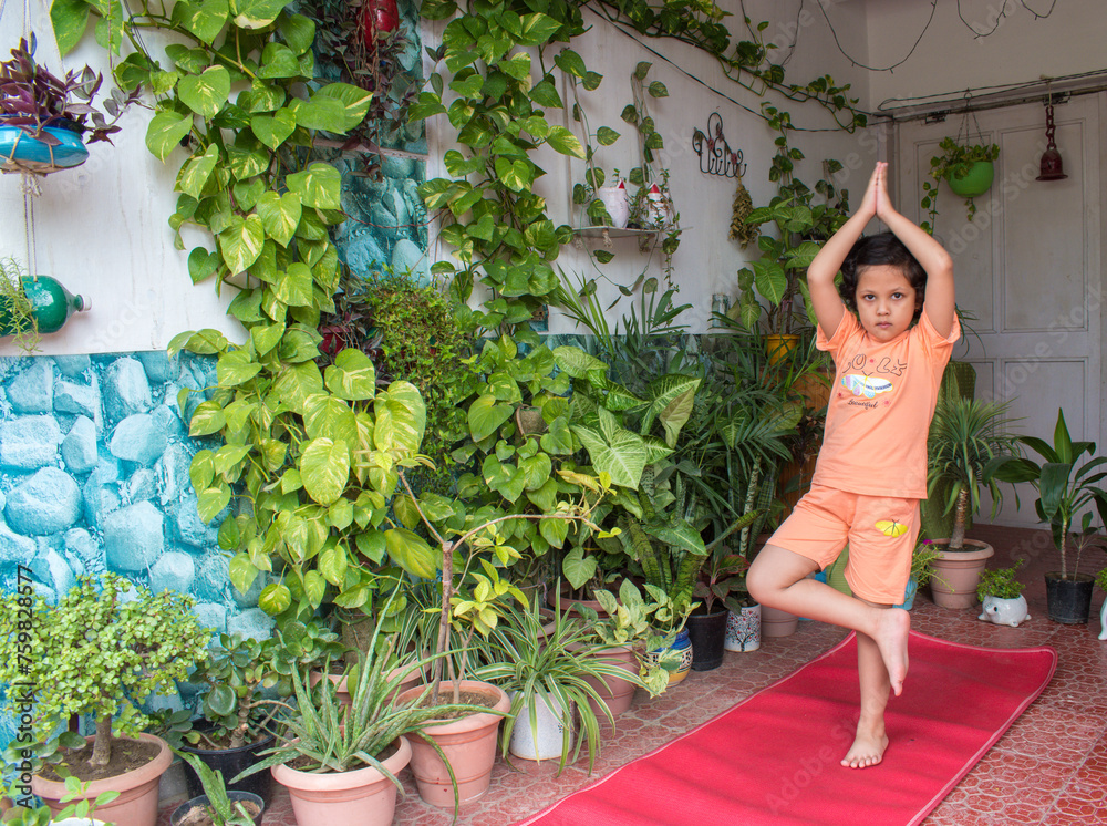 Little Girl Child practicing "Vrksasana" also known as Tree Pose at ...