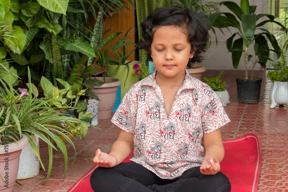 Girl Child relaxing and doing meditation at Terrace Garden of House ...