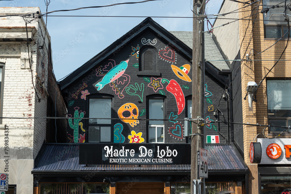 exterior building facade and decorations outside Madre De Lobo, a ...
