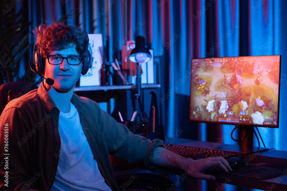 Host channel of young gaming streamer looking at camera to present ...