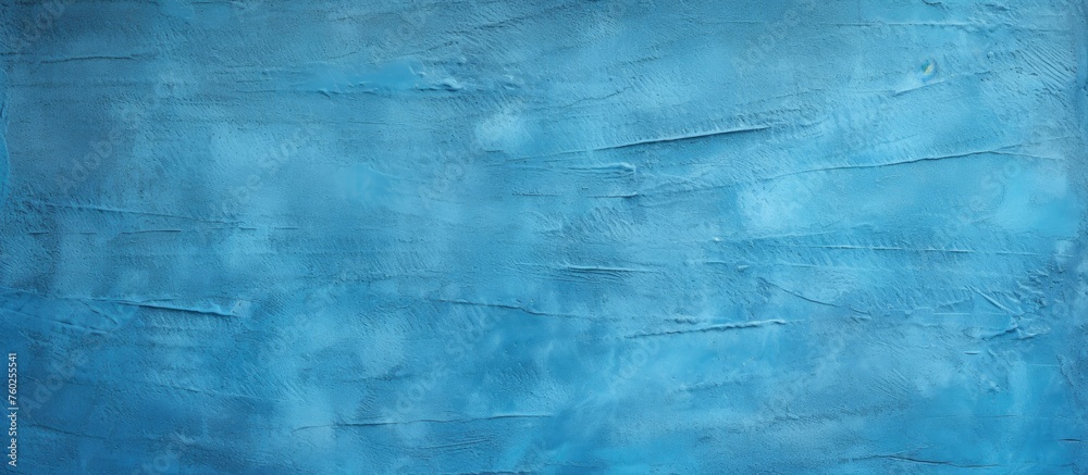 A fluid, electric blue wall with a textured pattern resembling liquid ...