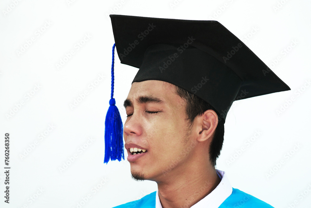Asian young man graduating with a sad face. Students Standing With ...