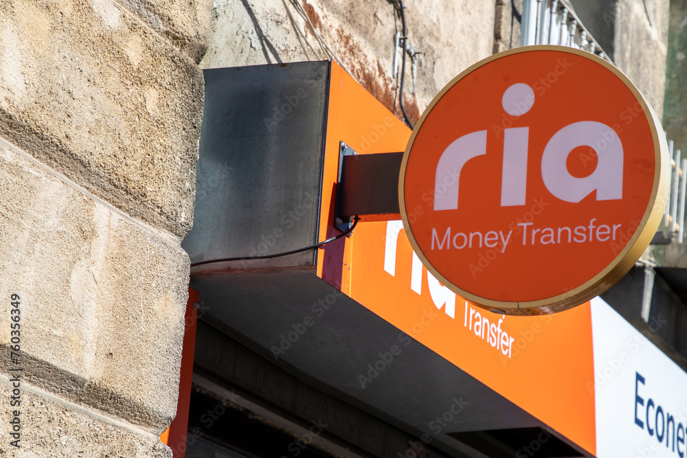 ria Money Transfer text brand and sign logo wall agency facade Money ...