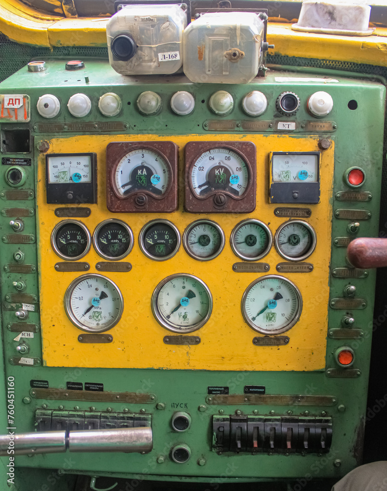 Antique train control panel with multiple analog gauges, switches and ...