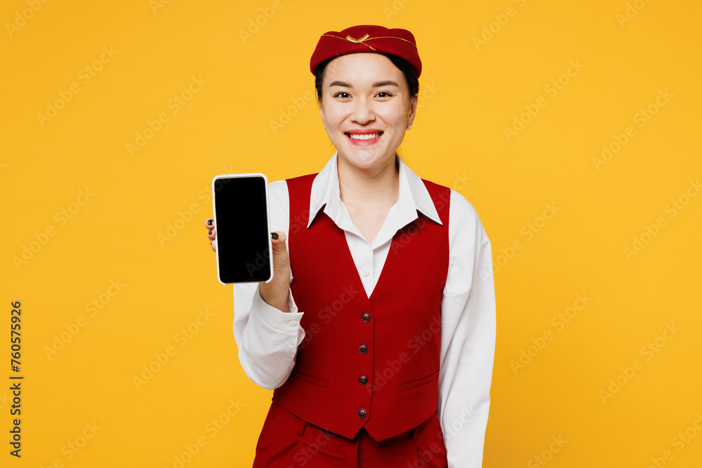 Young stewardess flight attendant woman of Asian ethnicity she wear red ...