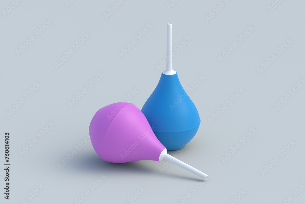 Two enemas on gray background. Rubber douching bag. Pear shaped syringe ...
