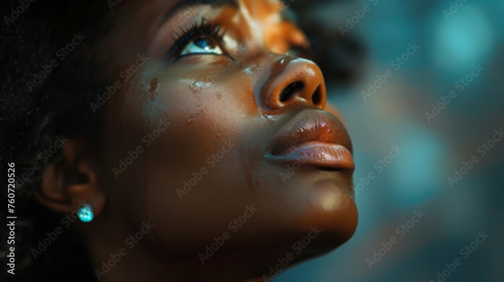 Touched by His Grace. Beautiful young black woman looking up with tears ...