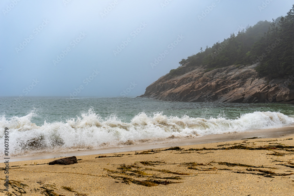 Crashing waves on Sand Beach in Acadia National Park, Maine. Surrounded ...