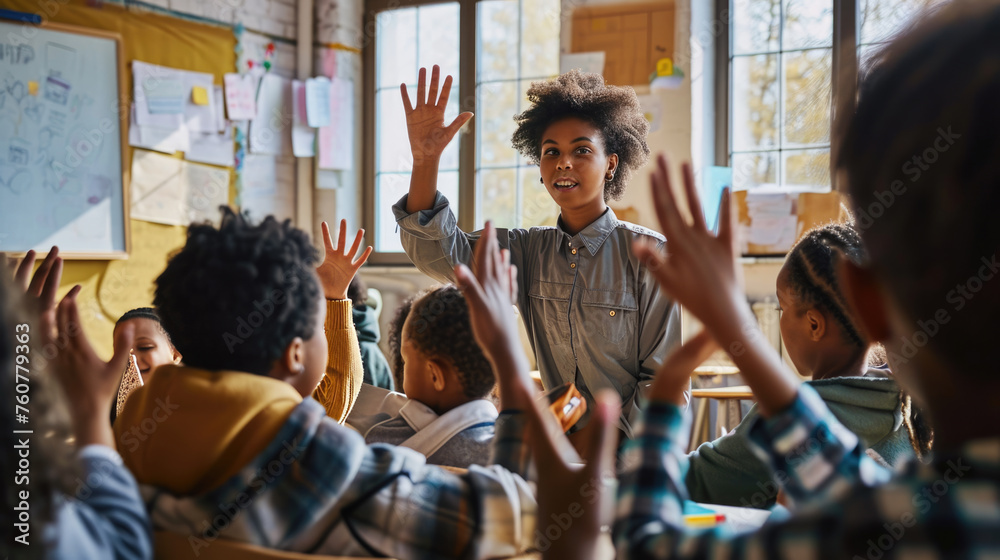 Teacher is raising her hand in a classroom setting, surrounded by young ...