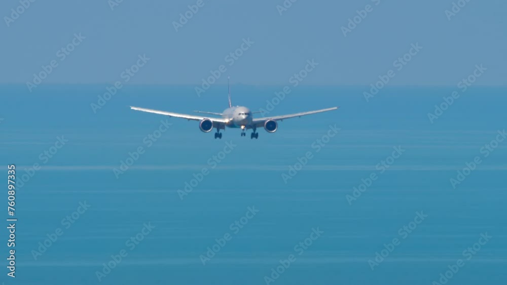 Airliner approaching landing, front view. Jet plane with unrecognizable ...