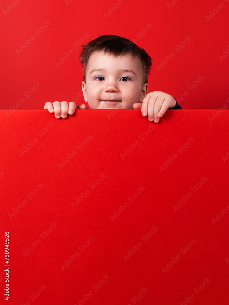 Baby in red flannel shirt on red background. Child's emotions, template ...