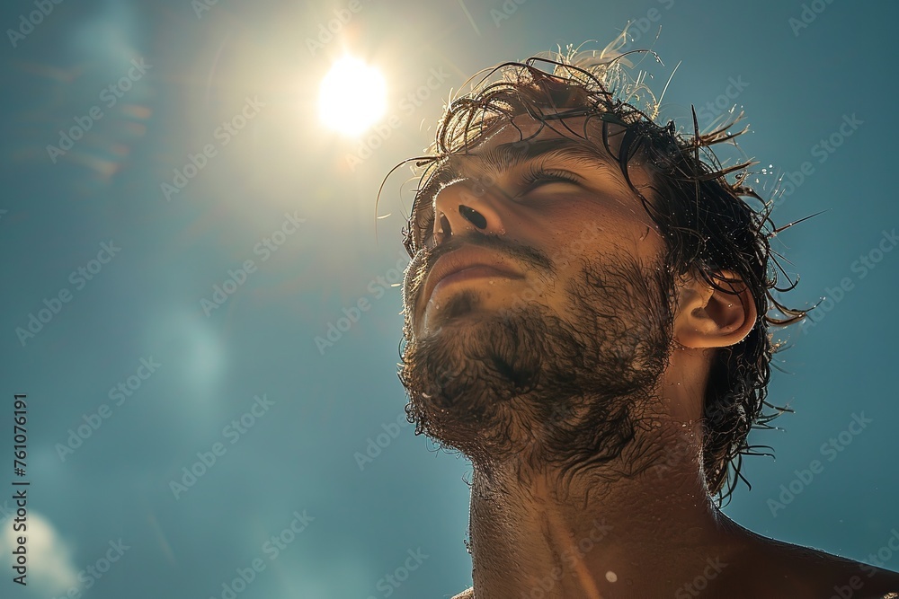 Over the sky backdrop, a man continues to choke from the heat of the ...