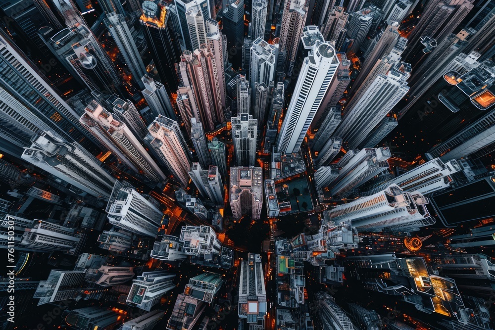 An aerial view captures the brightly lit streets and towering ...