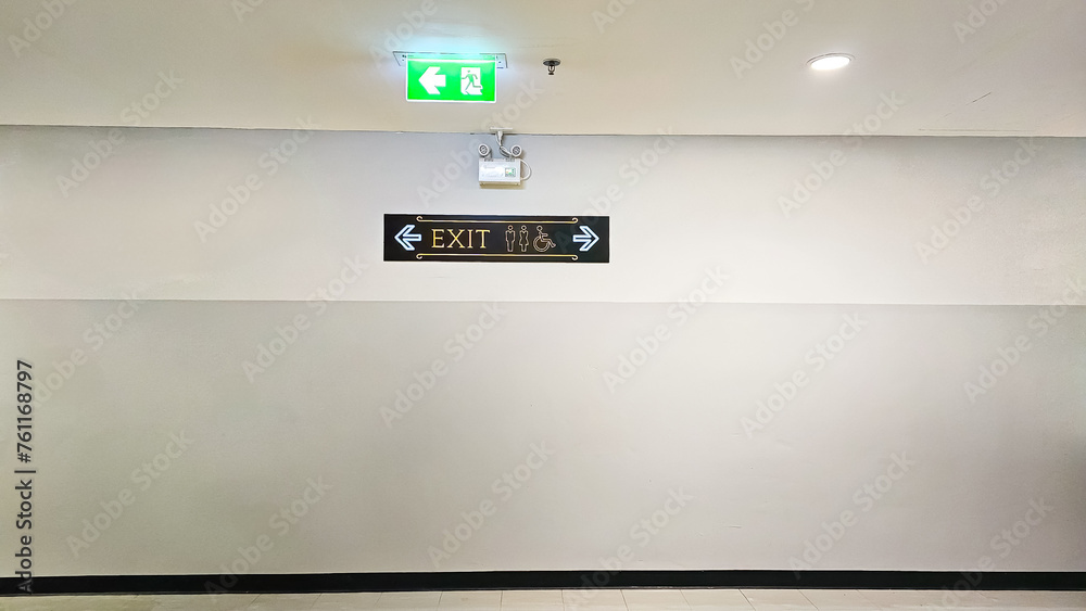 Public fire exit entrance with toilet sign. Empty public toilet ...