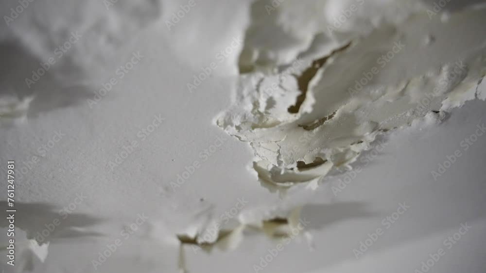 Vidéo Stock White paint falling and peeling off ceiling or wall in ...