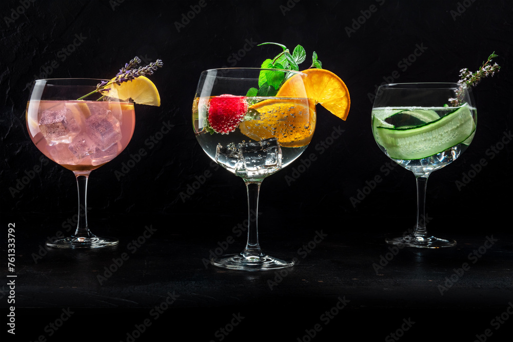 Fancy cocktails with fresh fruit. Gin and tonic drinks with ice at a ...