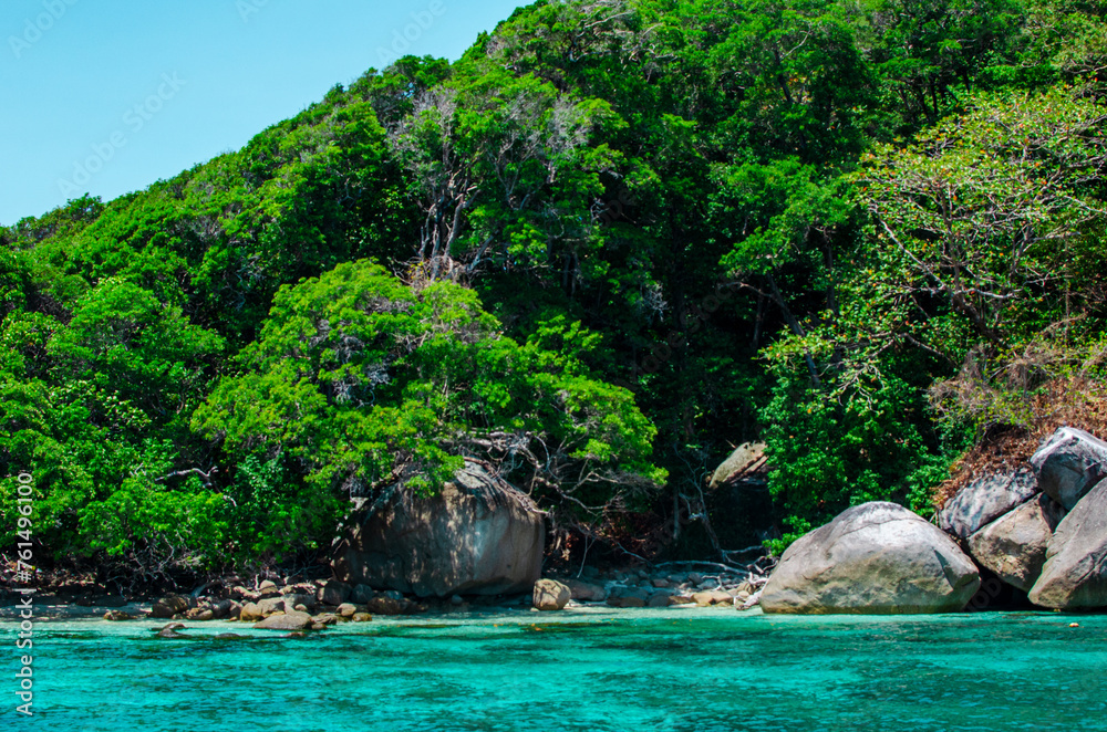 Tropical islands of ocean blue sea water and white sand beach at ...