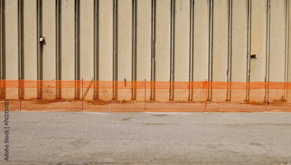 Safety Temporary Orange Plastic Netting Fence For Construction Industry In Front Of A Large