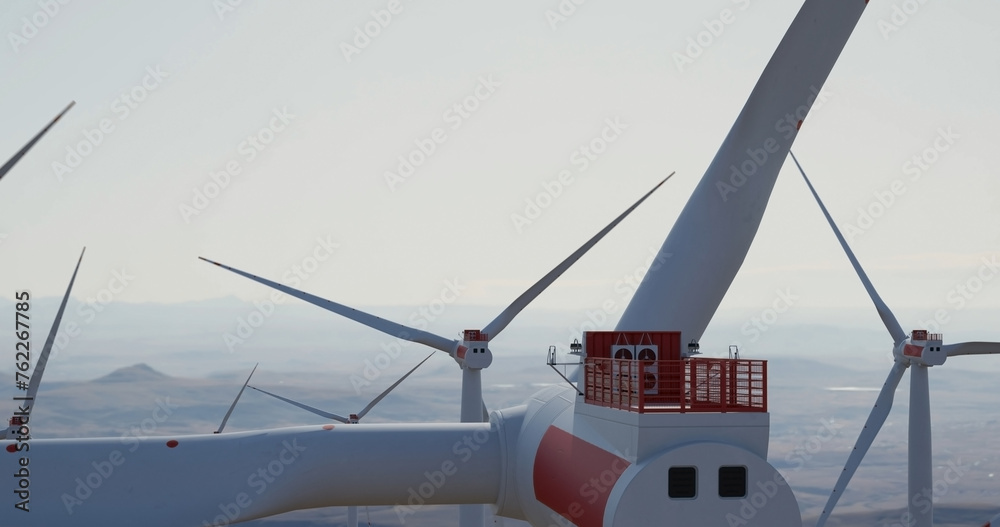 Large wind turbine rotating blades . Engineer performing repairing and ...
