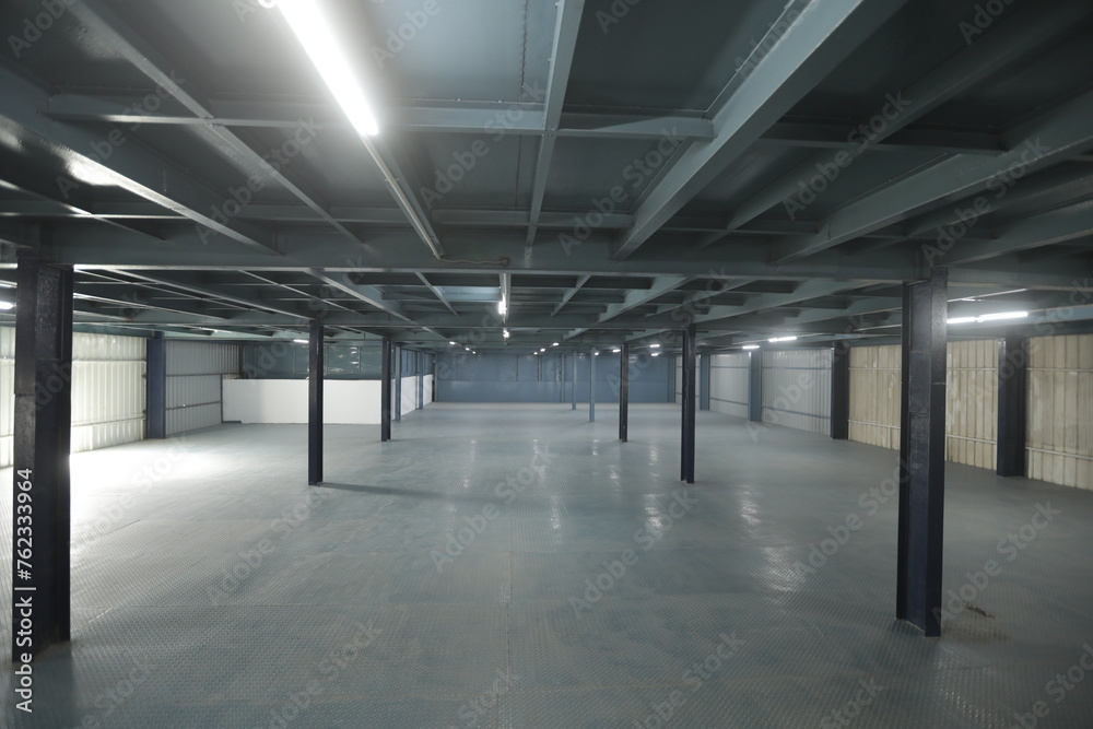 empty warehouse filled with pharma blue container rack for storage and ...