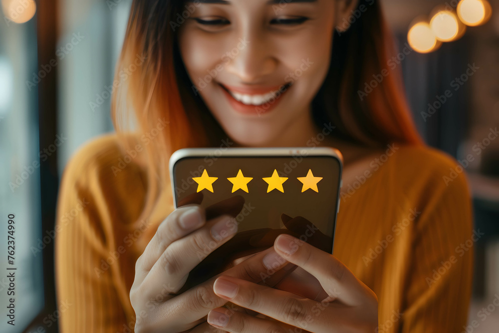 Happy customer leaving positive reviews and ratings on a mobile ...