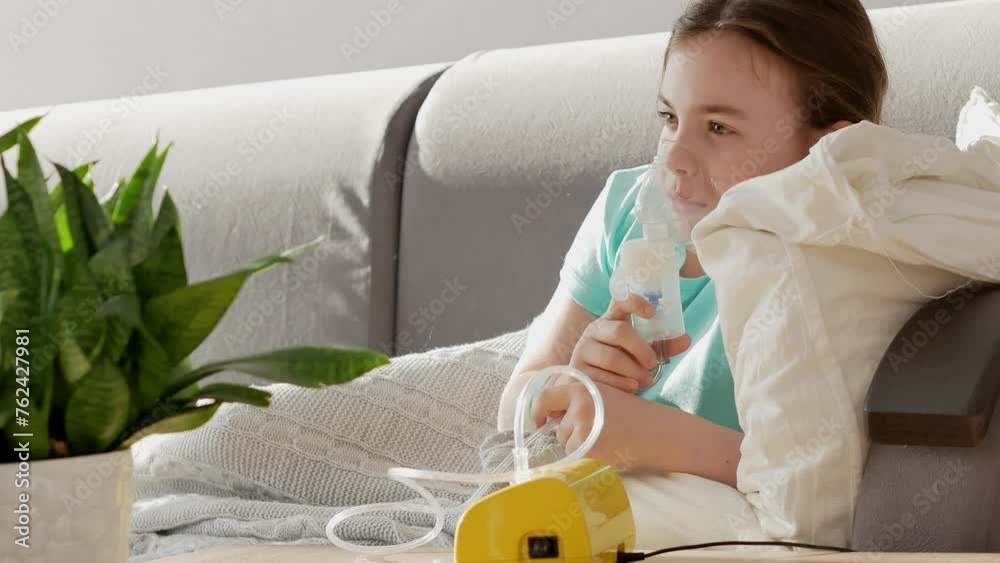 Cough treatment with a nebulizer a little girl makes inhalations by ...