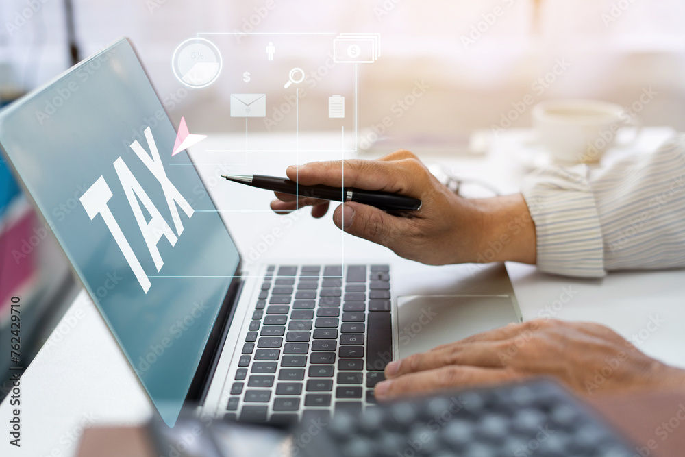 Concepts, for filling out taxes online A human hand is pointing at a ...