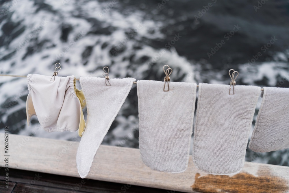 clothes drying on a washing line on a yacht boat traveling over the ...