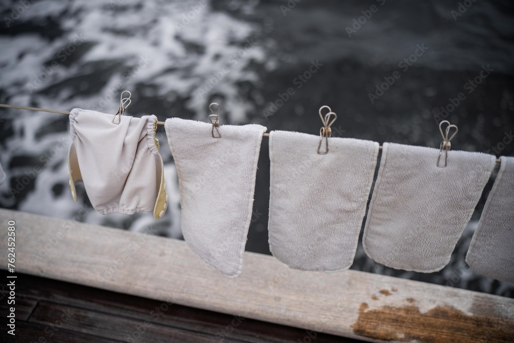 clothes drying on a washing line on a yacht boat traveling over the ...