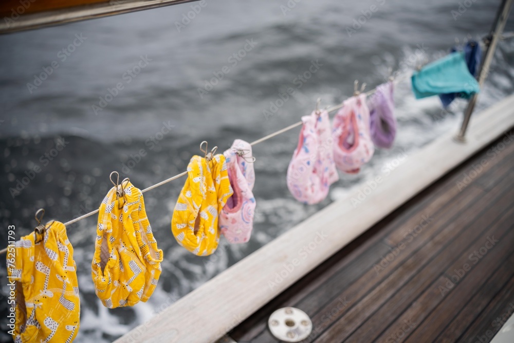 clothes drying on a washing line on a yacht boat traveling over the ...